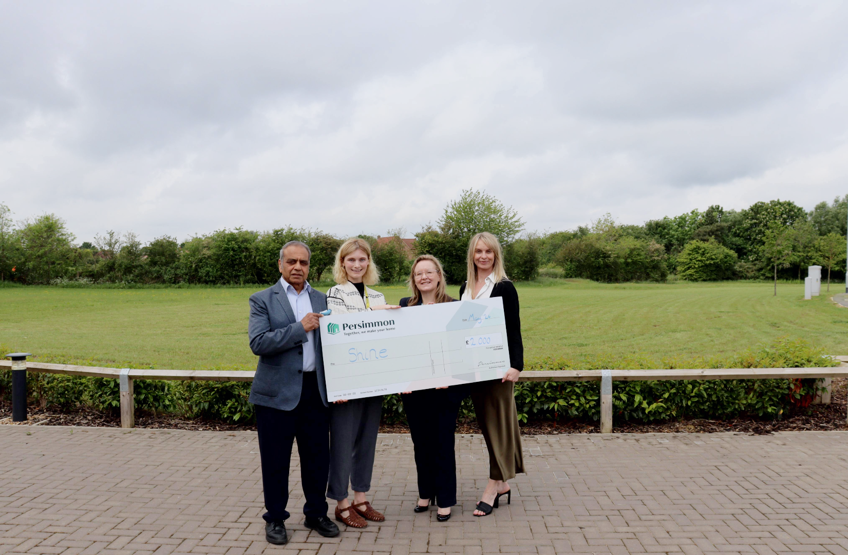 East Midlands team donates to Shine charity